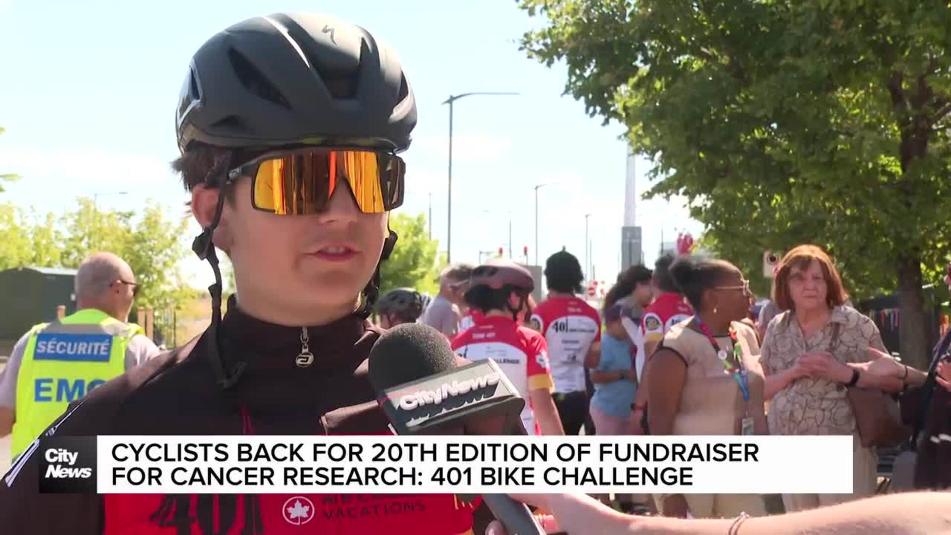 Cyclists of the 401 Bike Challenge pedal across the finish line