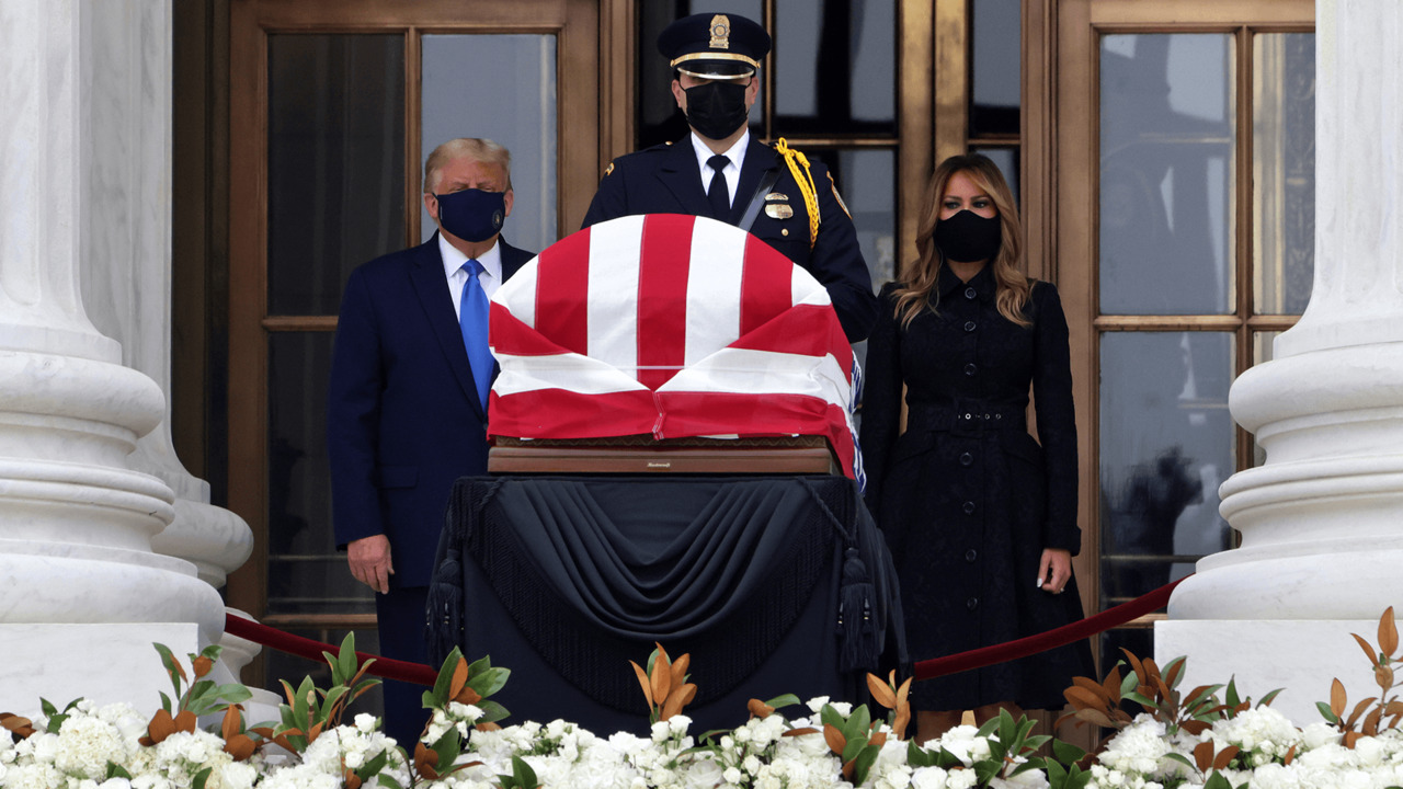 Trump is greeted by boos and 'vote him out' chants at RBG viewing ...