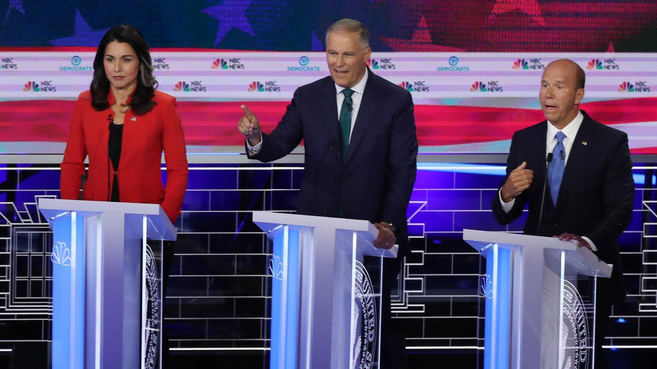 John Delaney struggles to get a word in during the debate - POLITICO