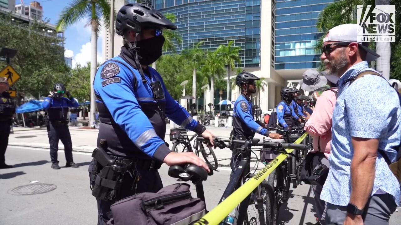 Police move media behind yellow tape outside court | Fox News Video